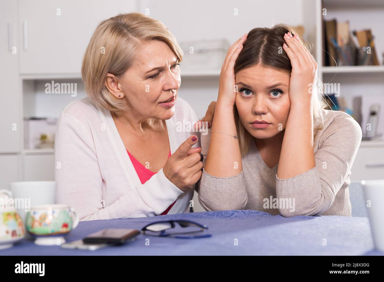 Mother scolds her adult daughter Stock Photo - Alamy