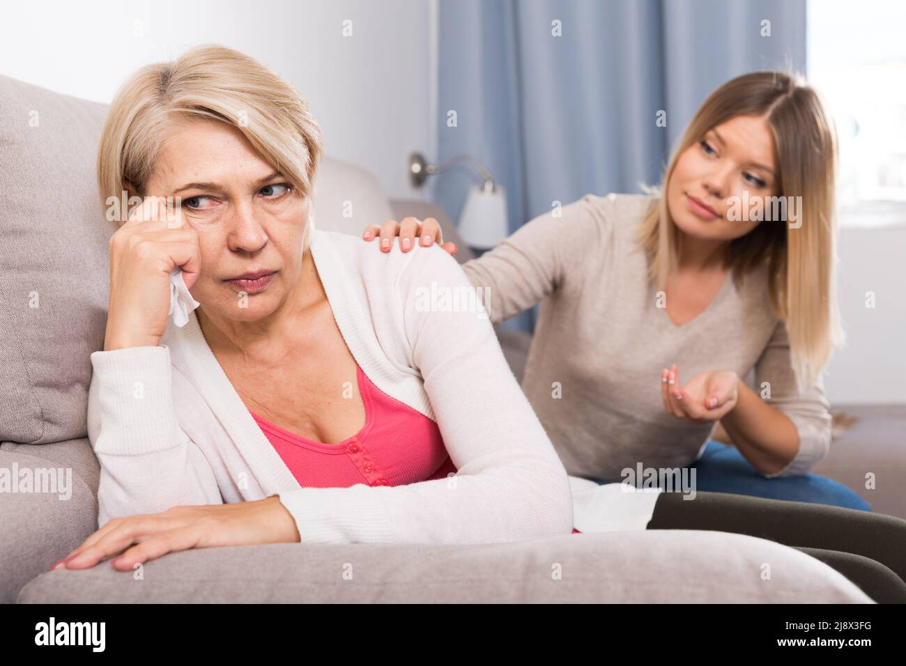 daughter comforts a sad mother Stock Photo - Alamy