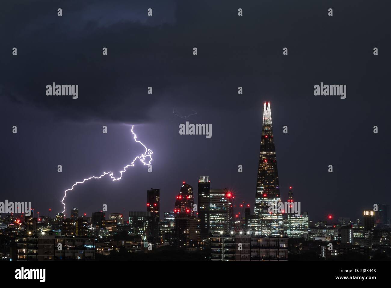 London, UK. 18th May 2022. UK Weather: Lightning strikes over the city ...