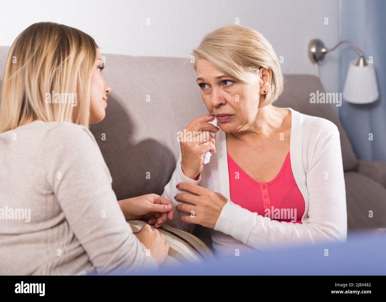 daughter comforts a sad mother Stock Photo - Alamy