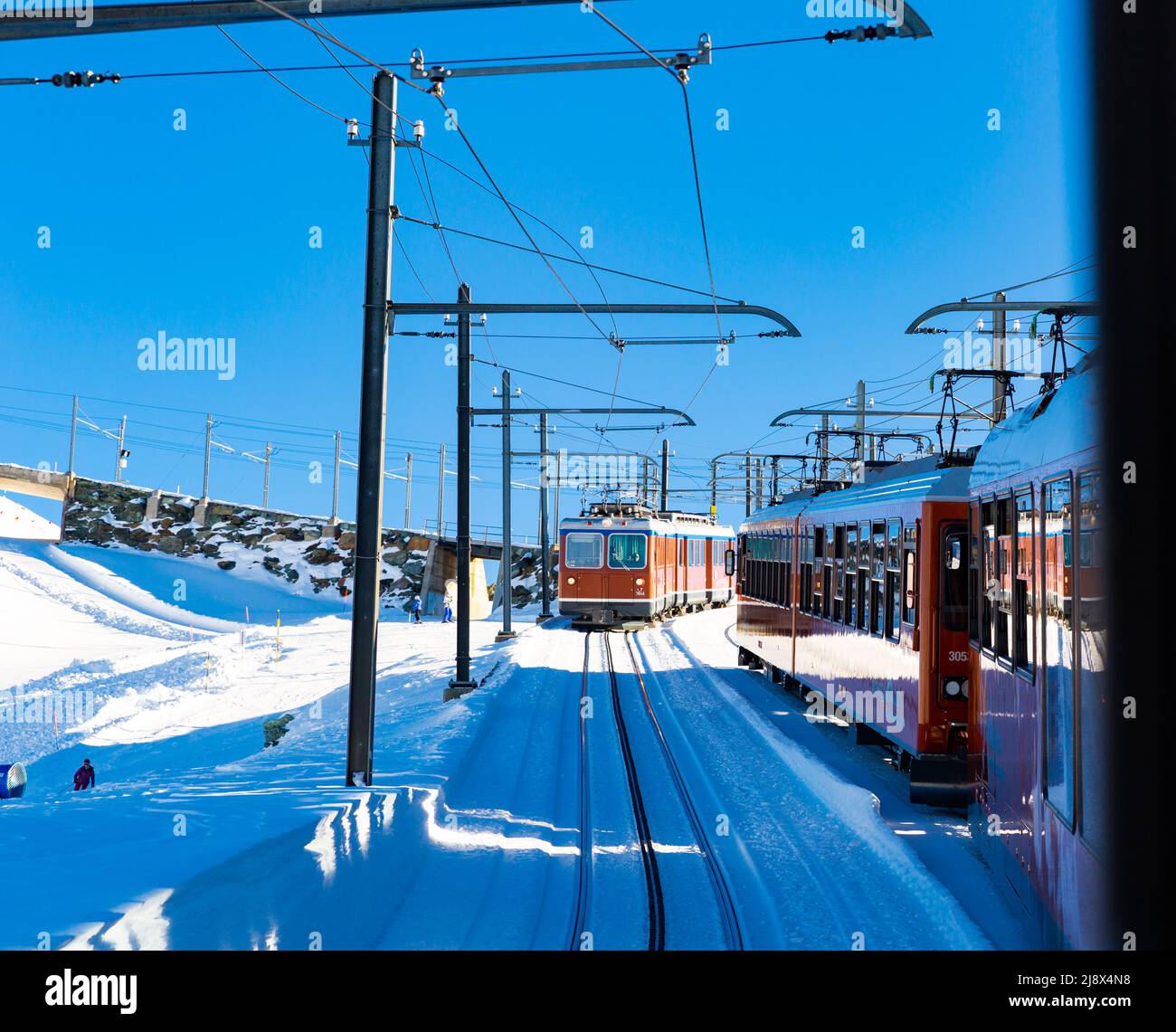 Train on mountain railway at Swiss Alps Stock Photo - Alamy