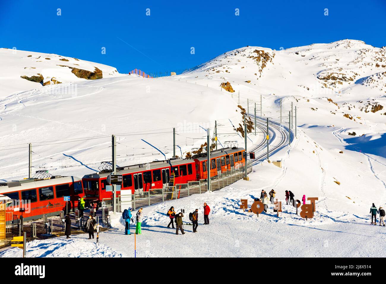 Train on mountain railway at Swiss Alps Stock Photo - Alamy
