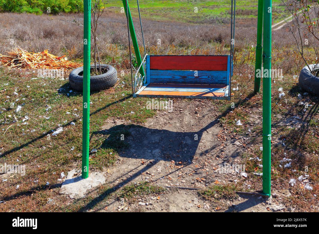 Rustic swing . Playground Backyard of a rural house Stock Photo - Alamy