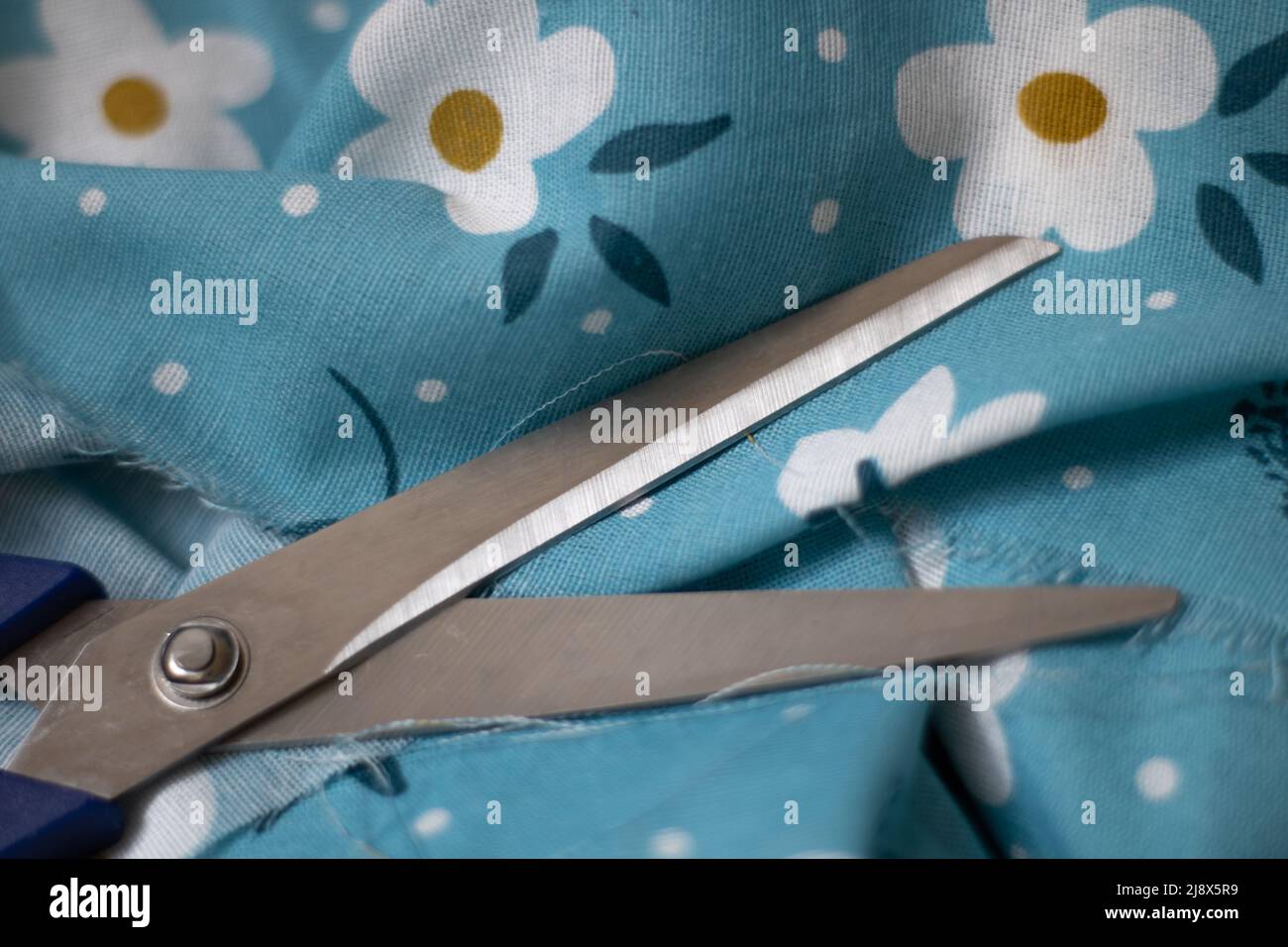 Scissors on fabric Stock Photo - Alamy