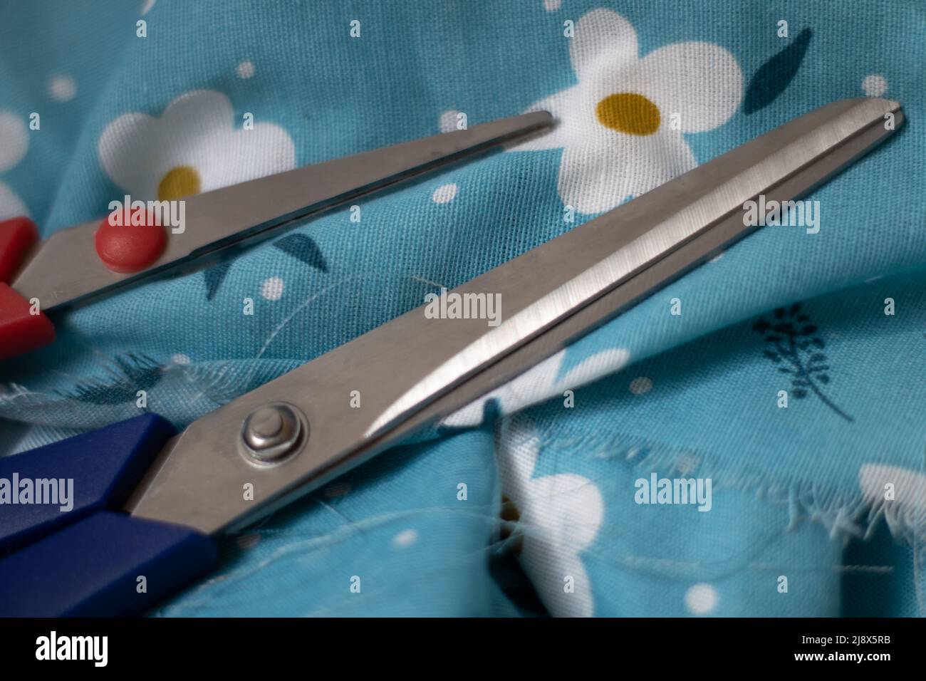 Scissors on fabric Stock Photo - Alamy