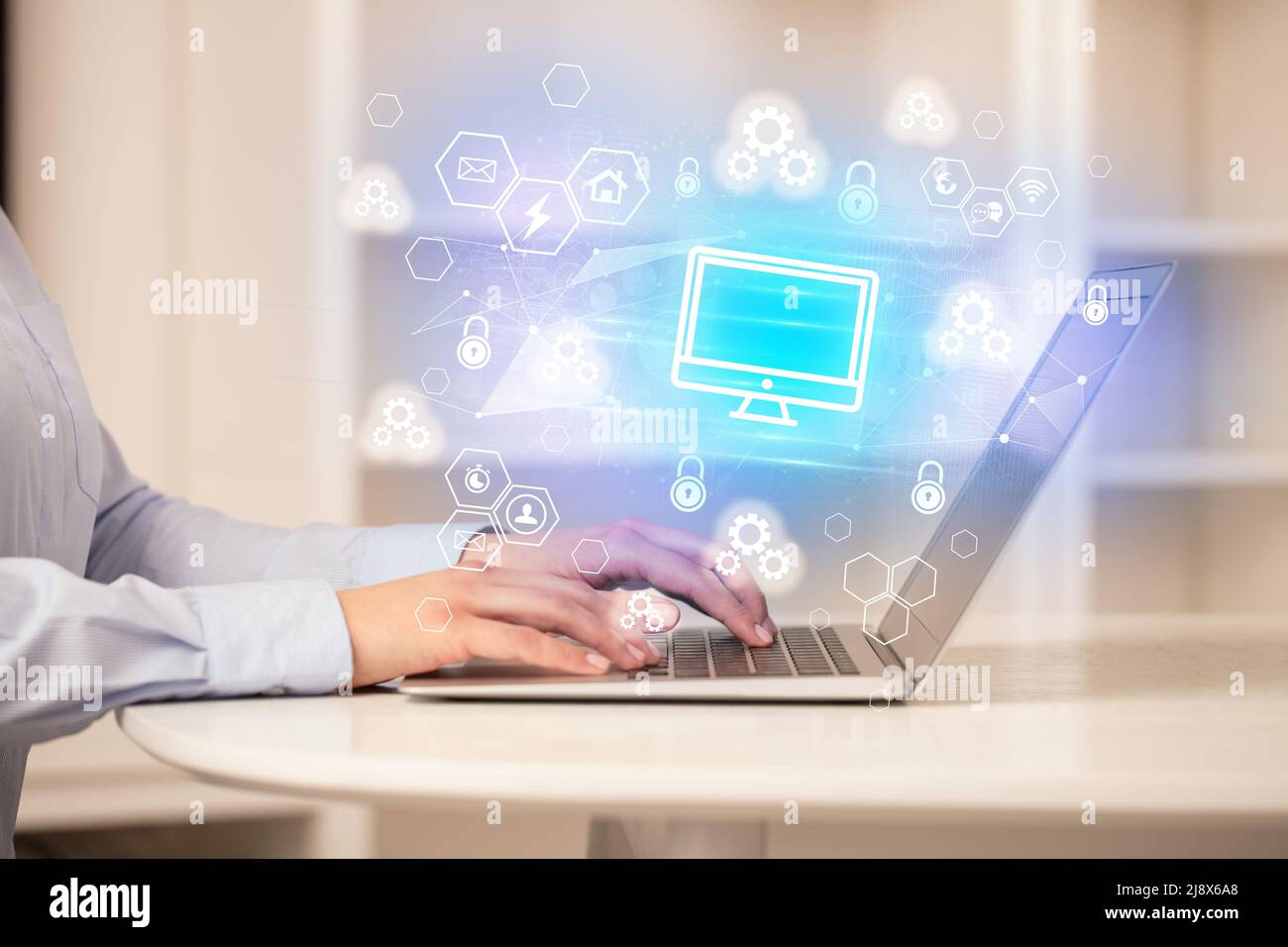 Hands working on laptop with digital icons Stock Photo - Alamy