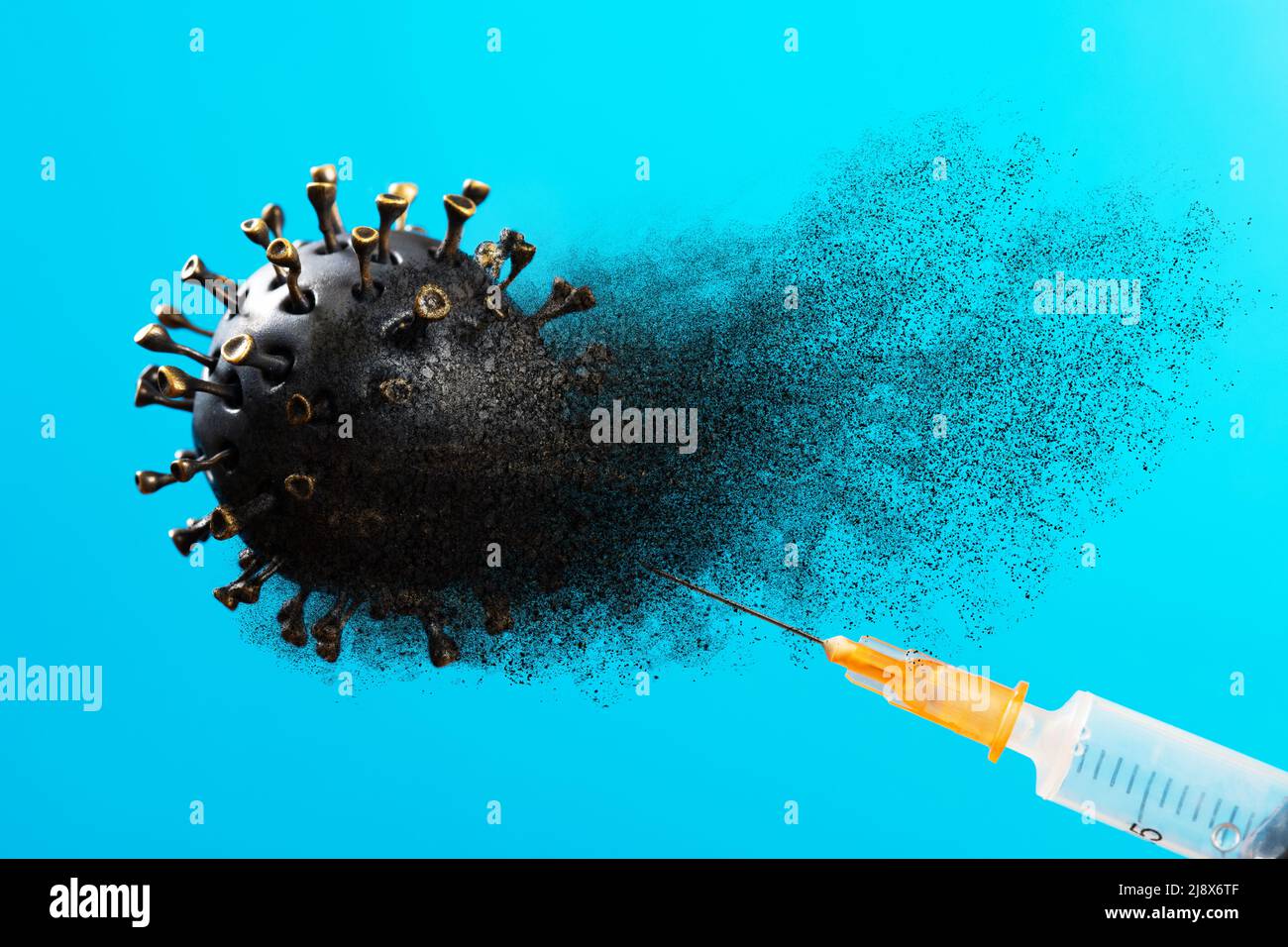 syringe and an exploding coronavirus on blue background Stock Photo - Alamy