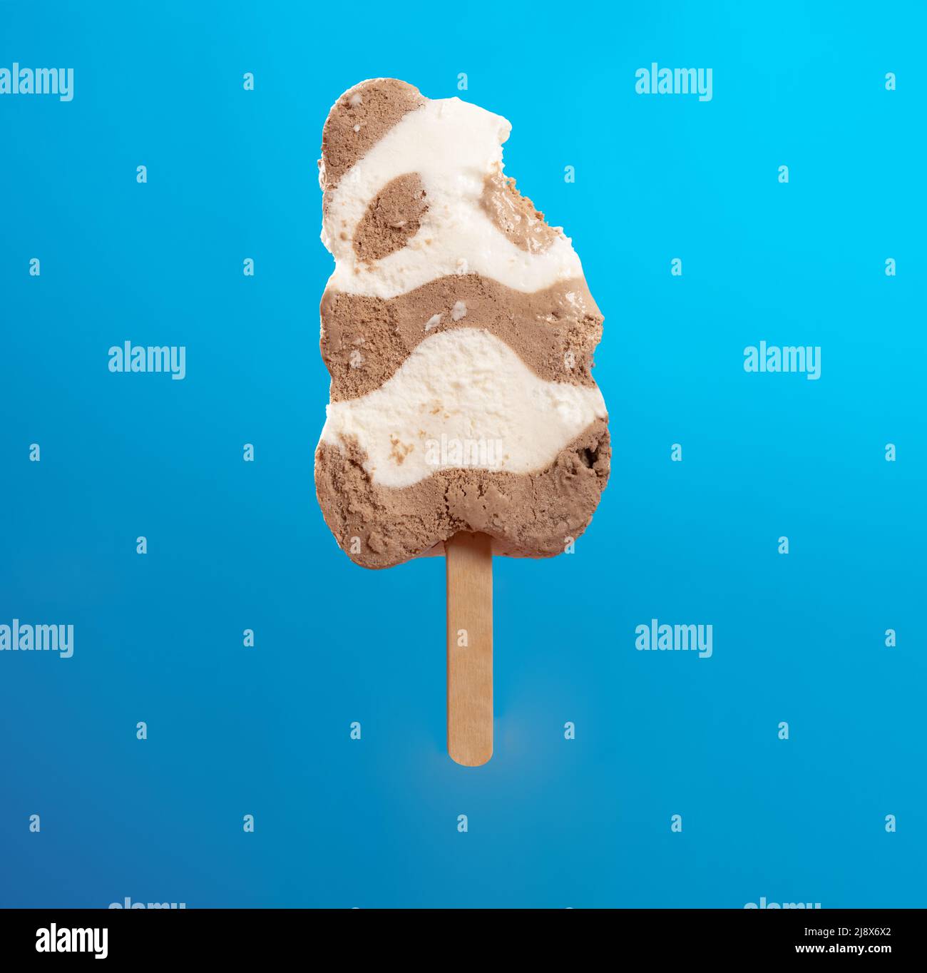 panda shape popsicle with a bite on blue background Stock Photo - Alamy