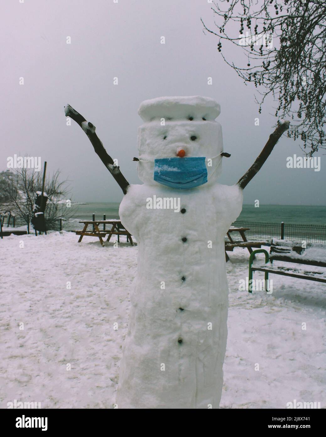 A snowman wearing a mask Stock Photo - Alamy