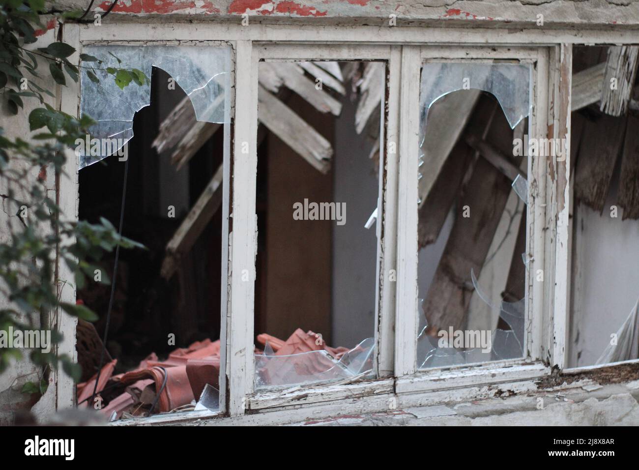 A destroyed house with broken windows Stock Photo - Alamy