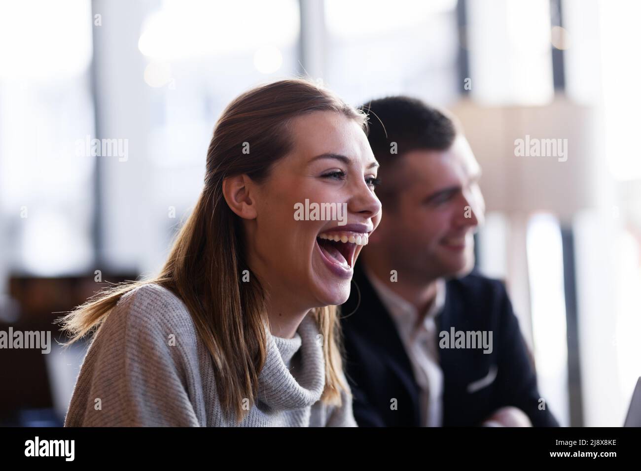 Friends having fun at a cafe bar. Smiling and laughing. Positive face ...