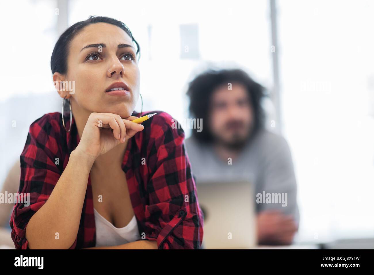 Students listening to a lecturer in a classroom. Smart young people ...