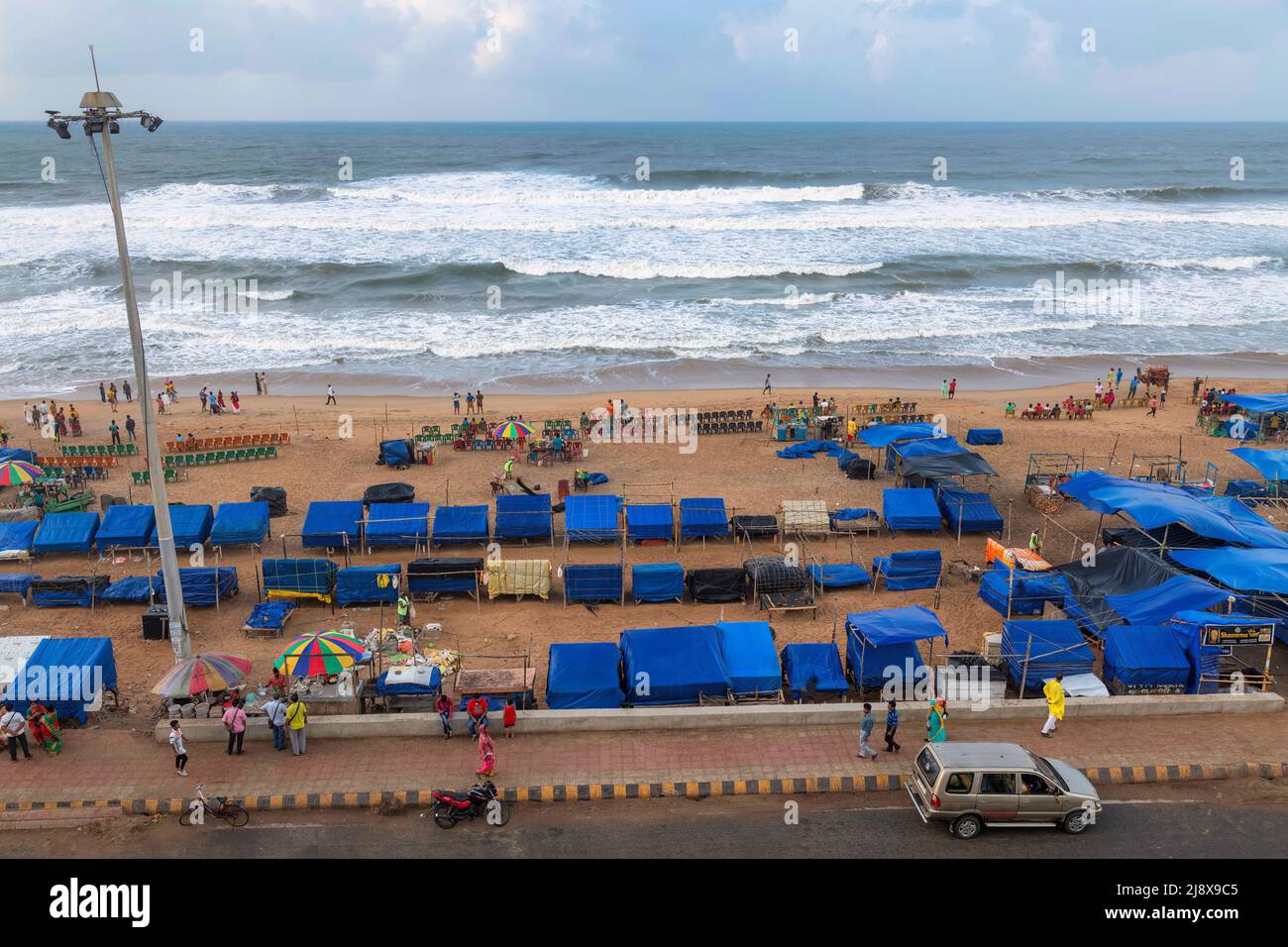 Aerial view of Puri sea beach with closed shops and highway road at ...