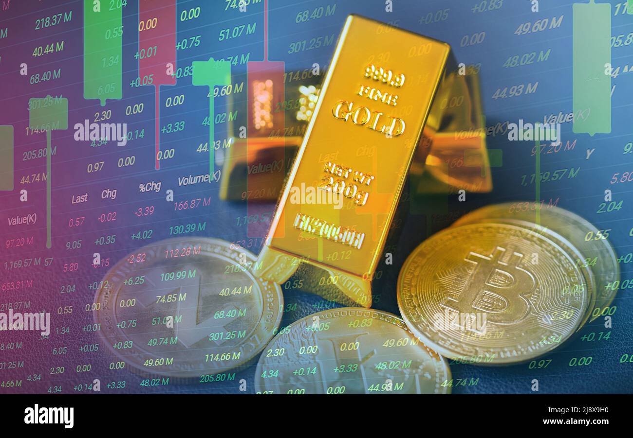 Bitcoin and Gold trading, gold bars on table with stock graph chart stock market trade ...