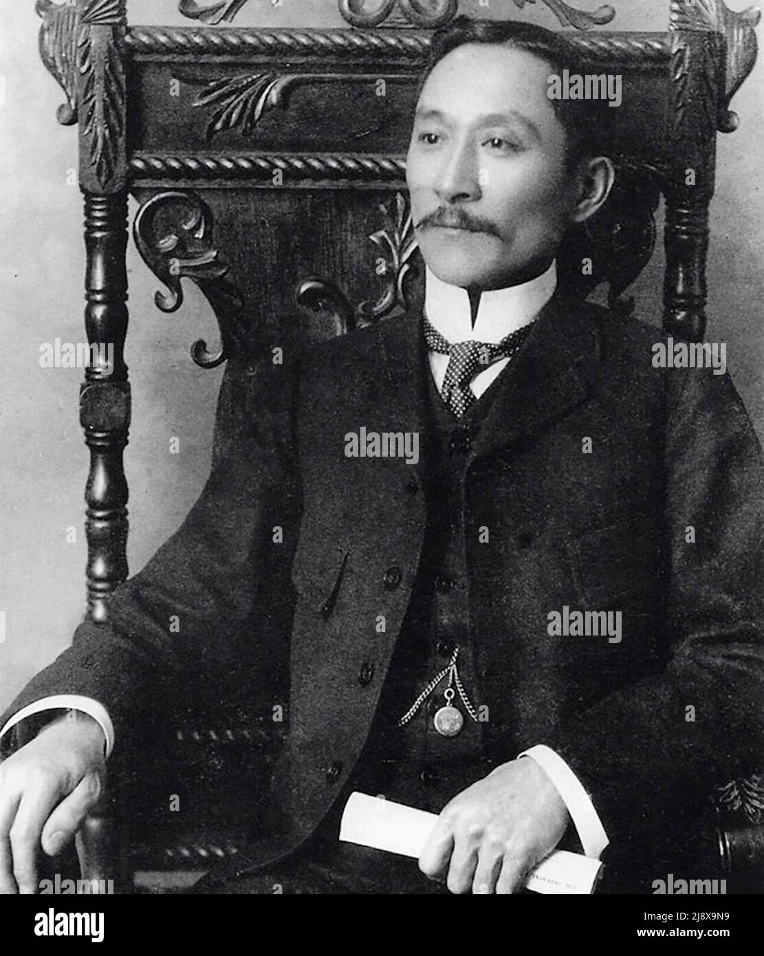 Won Alexander Cumyow as a young man with a handlebar moustache, dressed ...