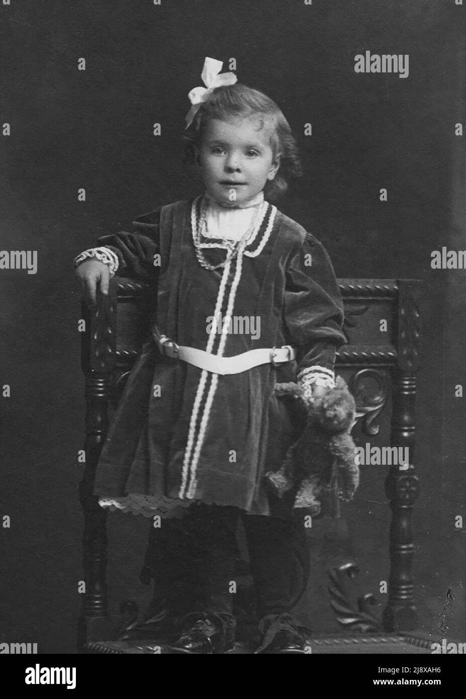 Early 1900s photo of Hazel Hawley as a child, standing on a chair with ...