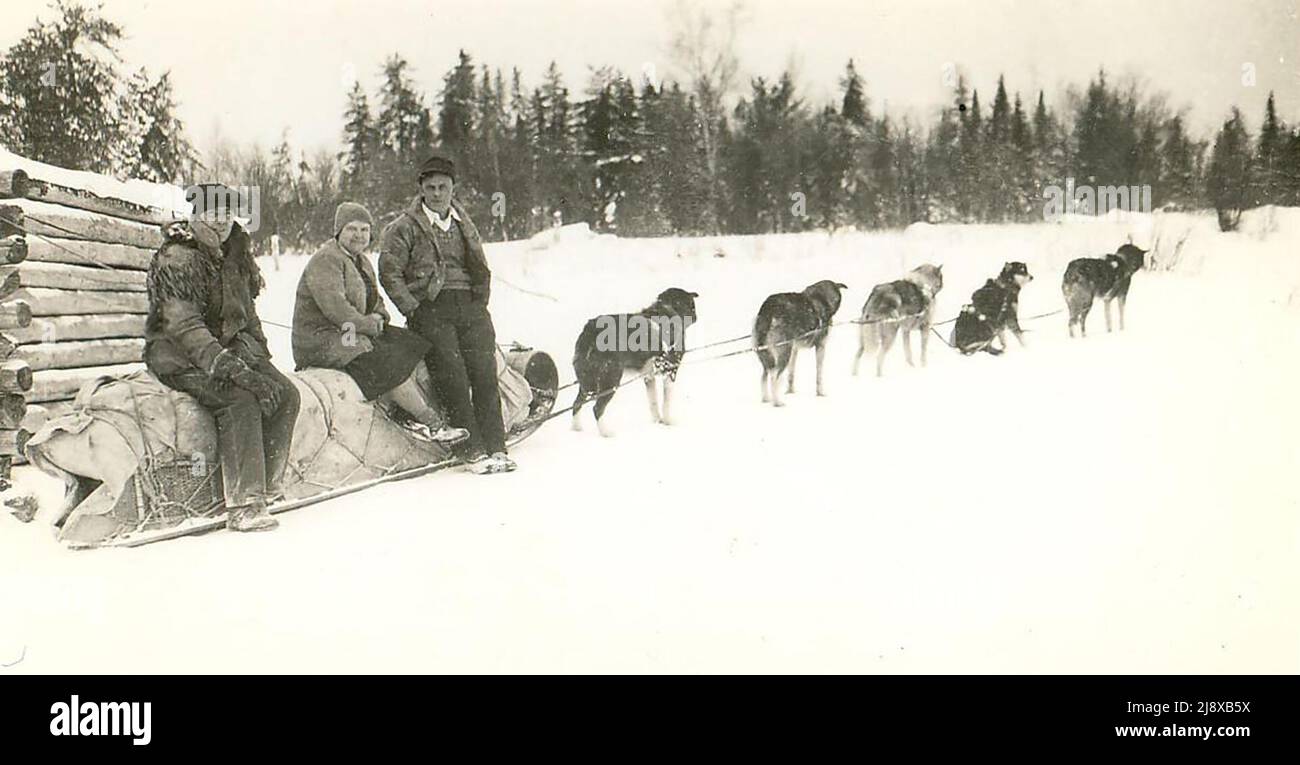 Men with dog sled Stock Photo - Alamy