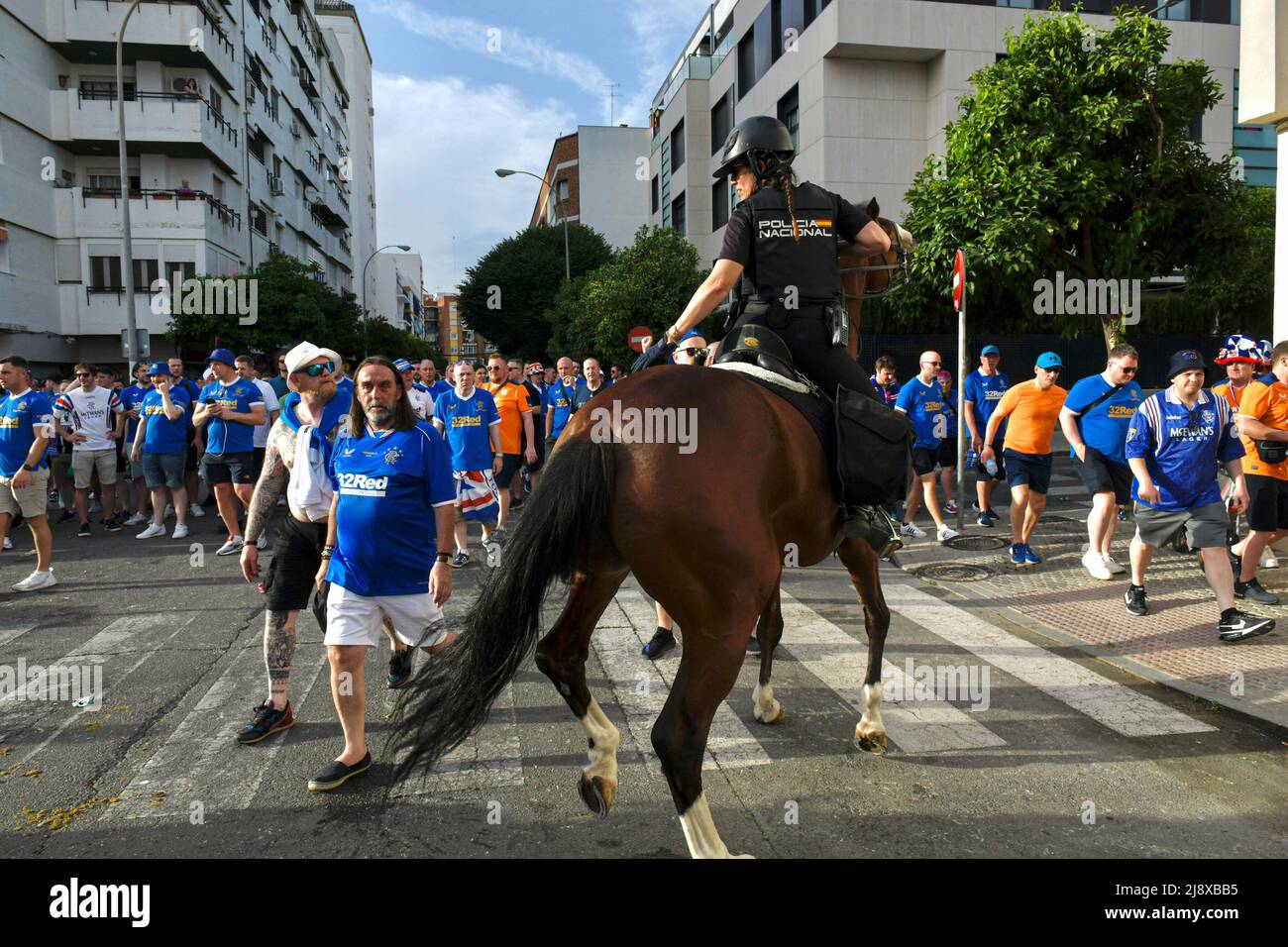 Seville, Spain. 18th May, 2022. Mounted police officer rides past the ...
