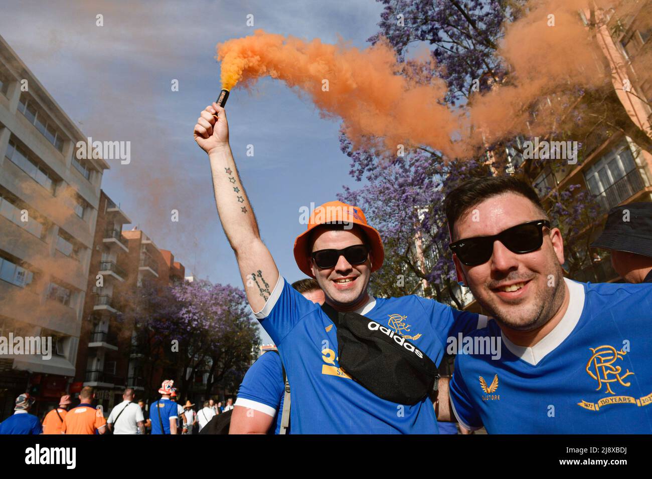 Seville, Spain. 18th May, 2022. Rangers fans walk with orange flare ...