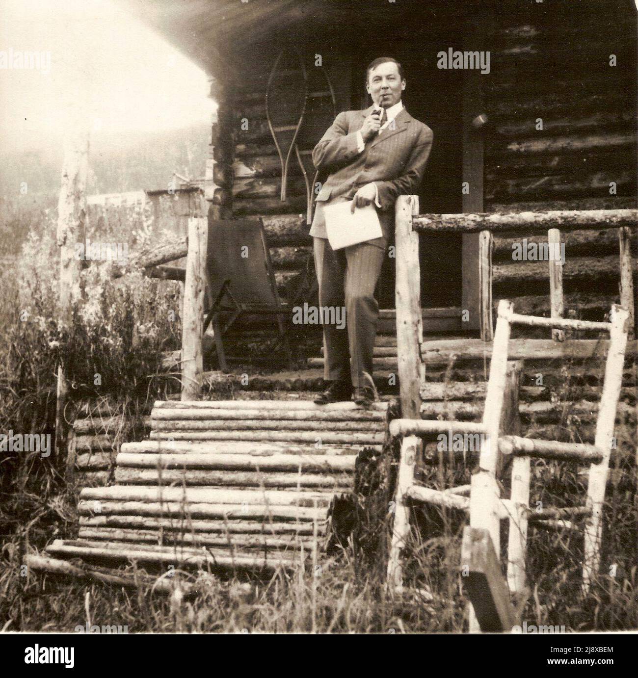 Robert Service and the Dawson Cabin ca. probably early 1900s Stock ...