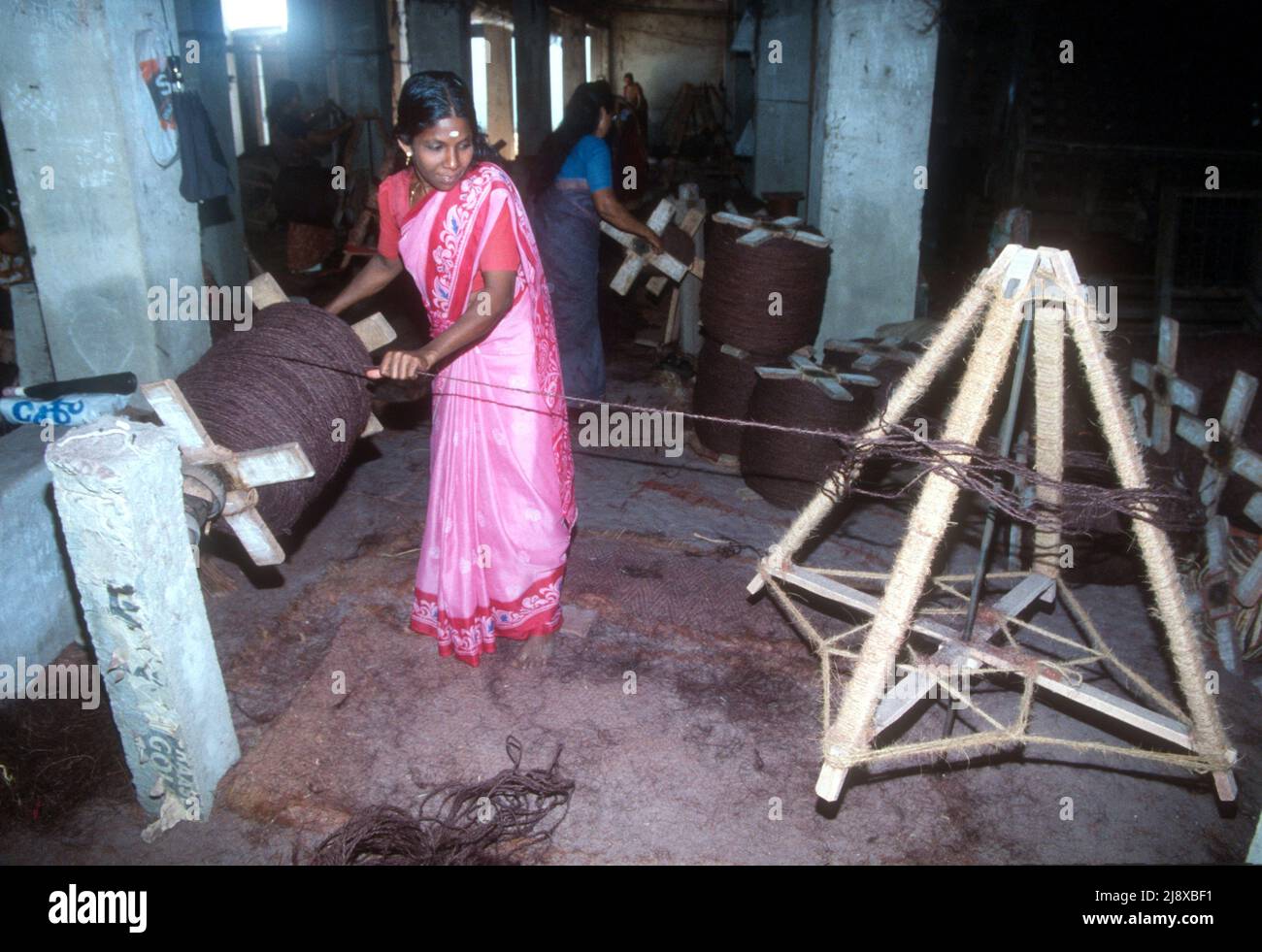 Spinning raw jute, small factory in Kerala India Stock Photo - Alamy