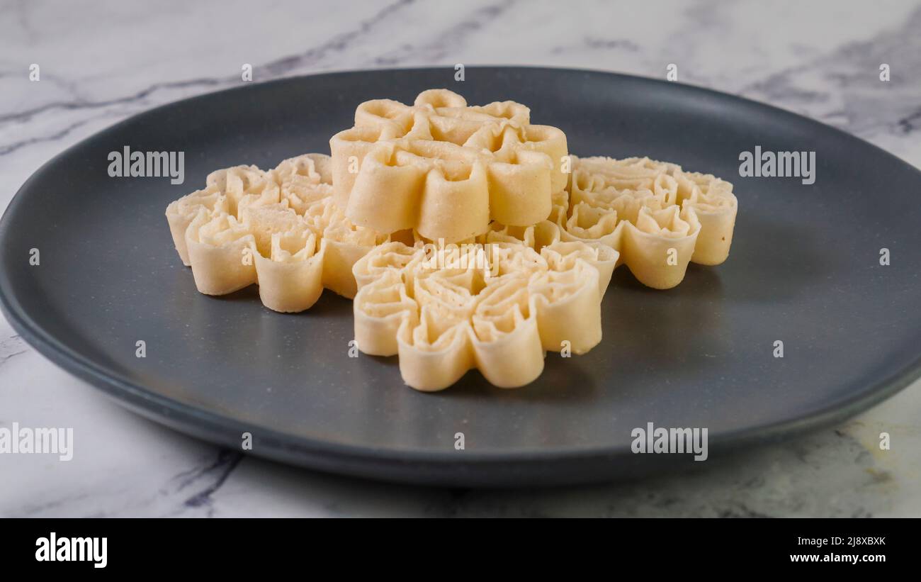 Malaysian Kuih Raya called Kuih Goyang or Kuih Ros. Popular traditional kuih raya on Hari Raya ...