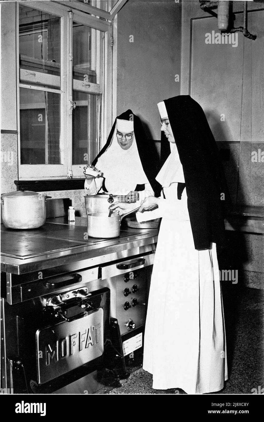 Two nuns working in a kitchen ca. 1945 Stock Photo - Alamy
