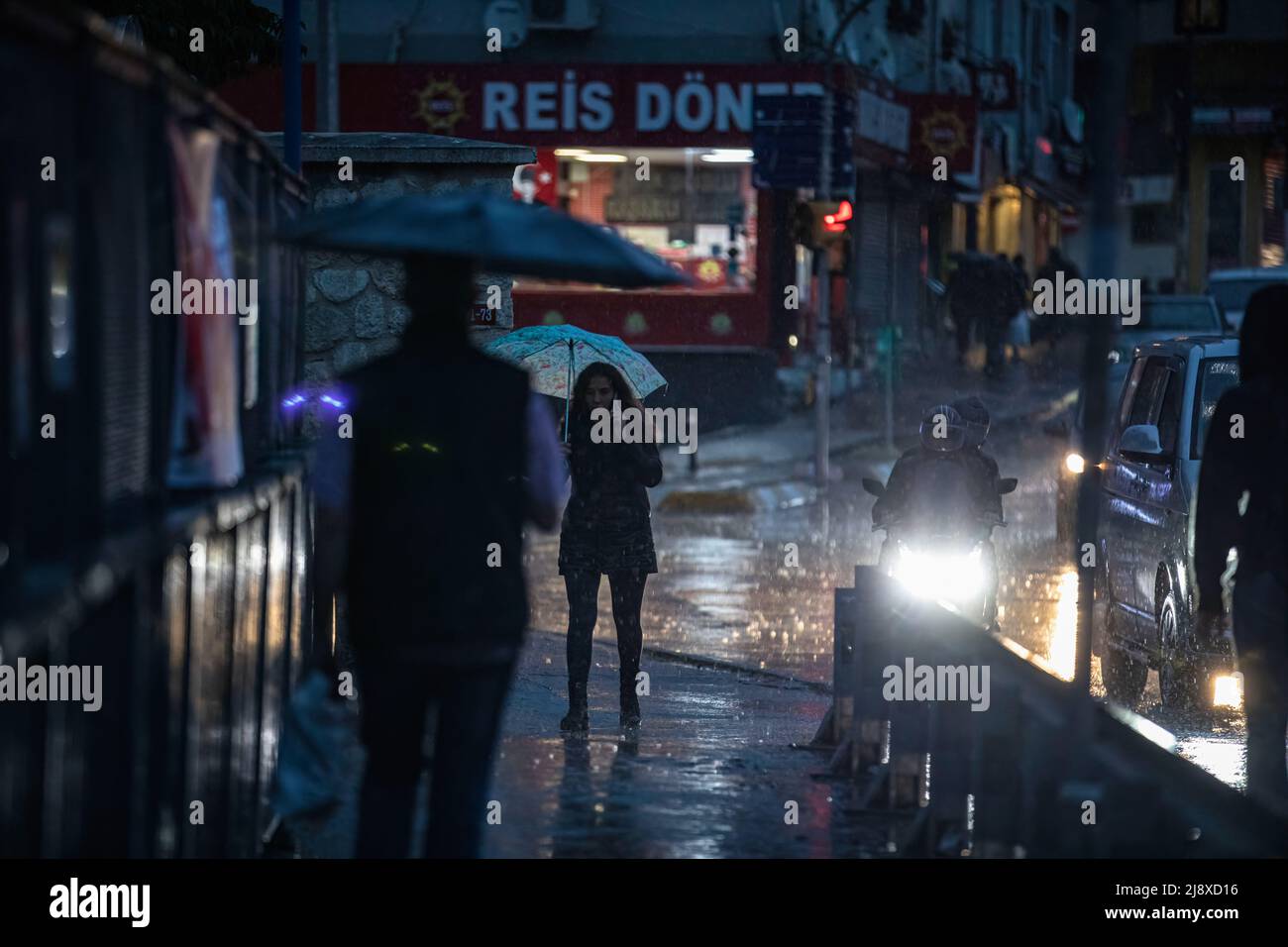 Istanbul, Turkey. 18th May, 2022. People with umbrellas seen during the ...