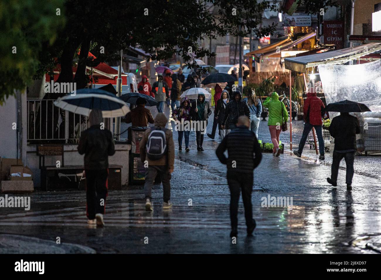 Istanbul, Turkey. 18th May, 2022. People seen walking with umbrellas ...