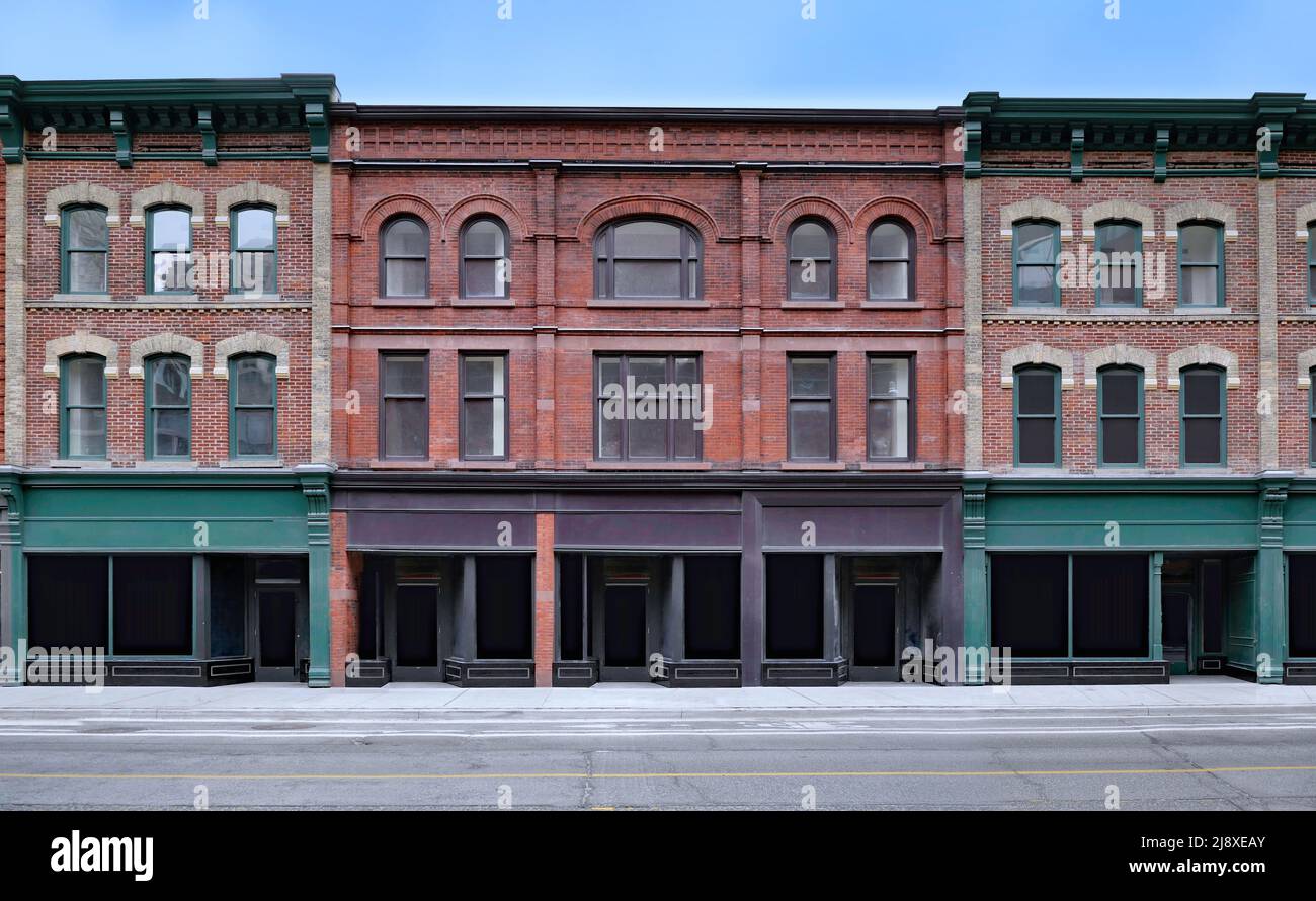 Old fashioned main street buildings with stores at ground level and ...