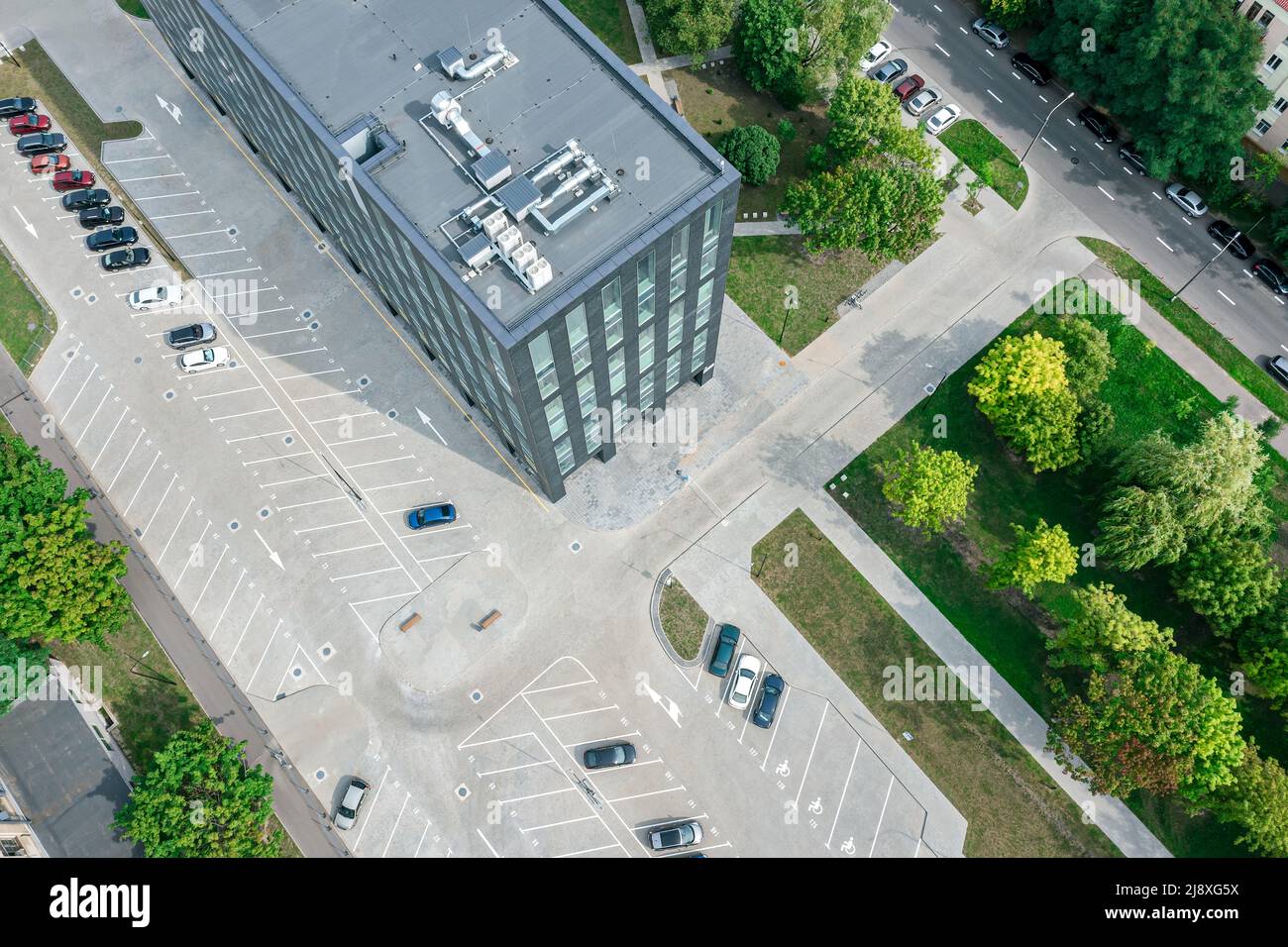 aerial view of parking lot with cars near the business center in ...