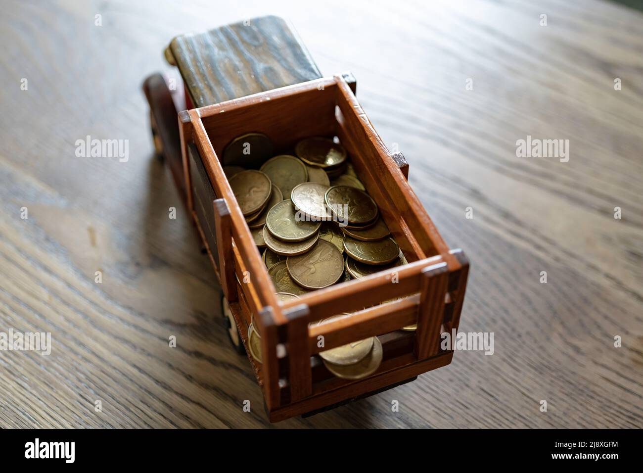Truck carrying coins on way to bank Stock Photo - Alamy