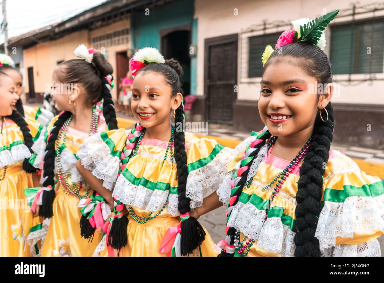 Group of girls in folkloric costume on a street in Leon Stock Photo - Alamy