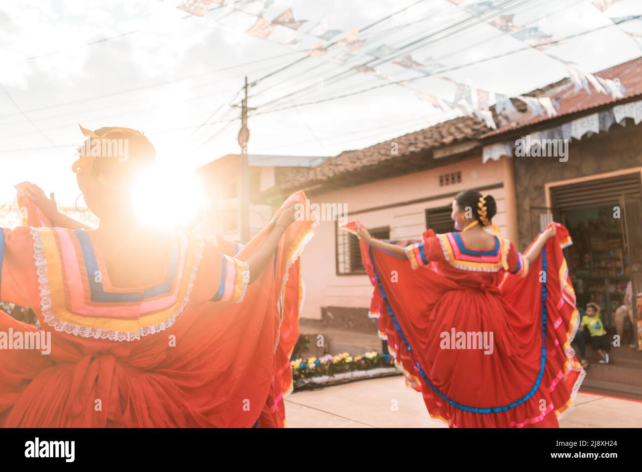Traditional Nicaraguan dancers with typical tajes dancing on an outdoor ...