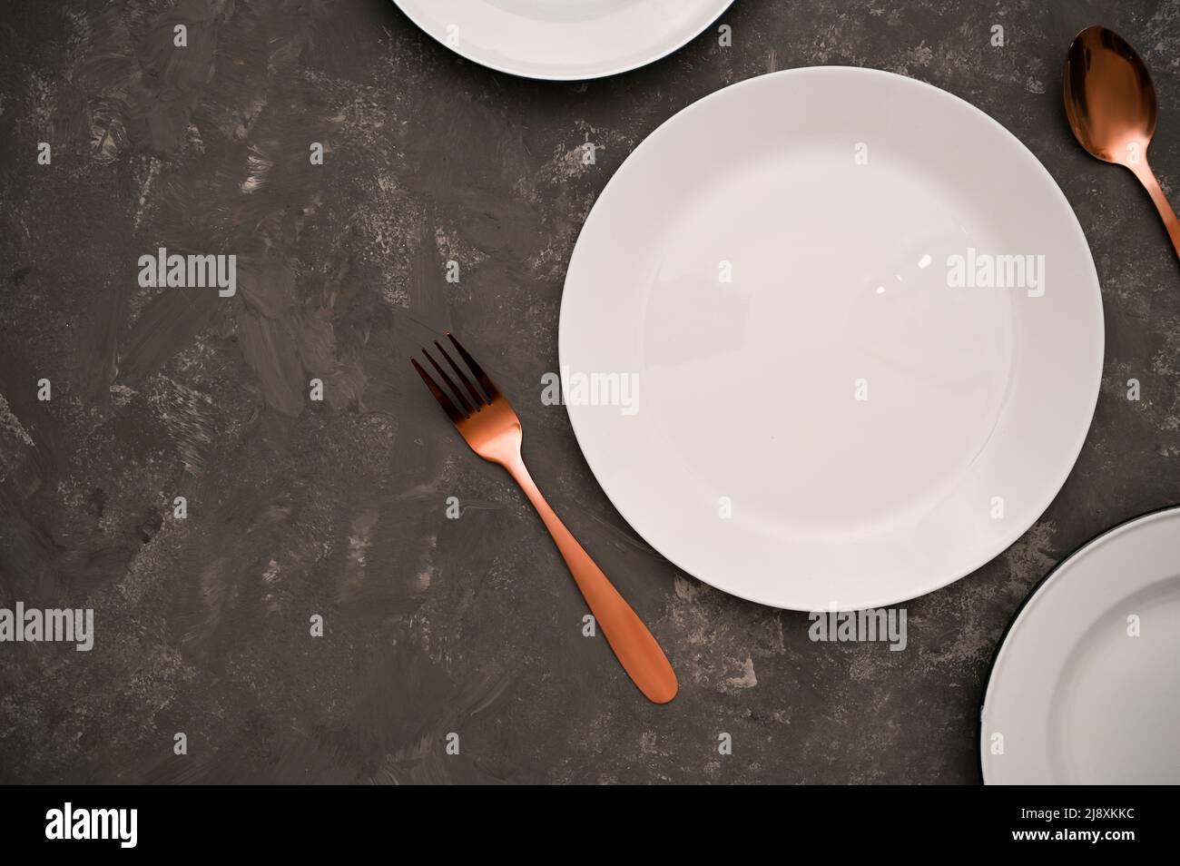 Modern dining table setting background with empty white plate and ...