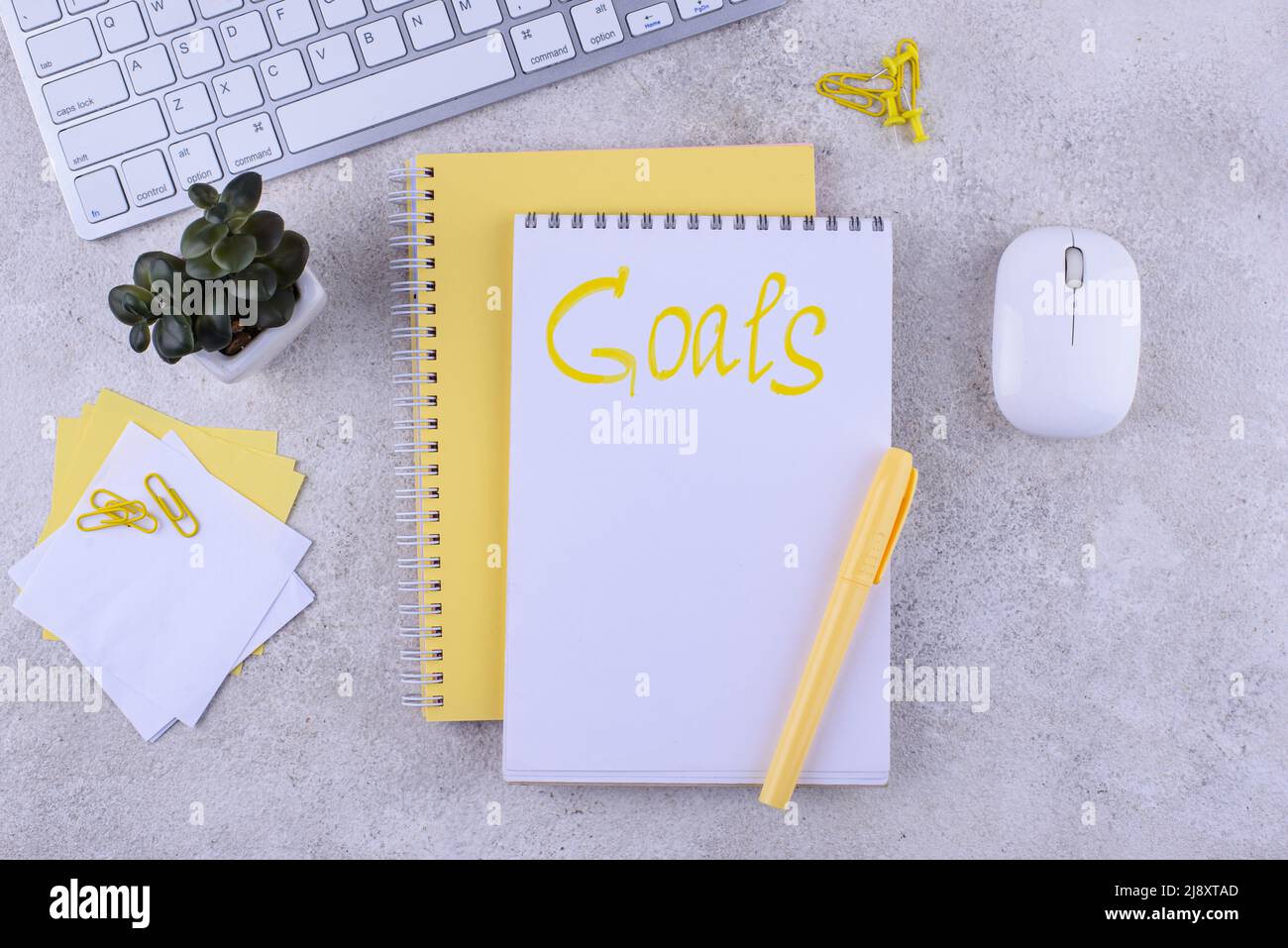 Target and goal concept with arrows and notebook Stock Photo - Alamy