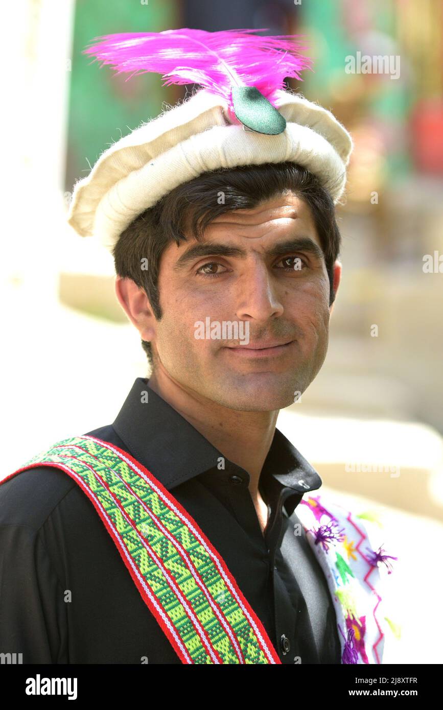 Kalashi women and men wearing traditional dresses participating in the ...