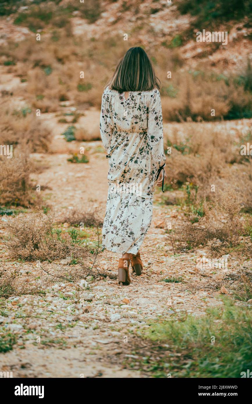 Woman walking away Stock Photo - Alamy