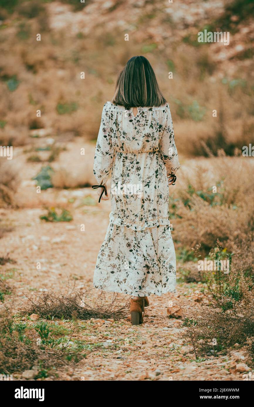 Woman walking away Stock Photo - Alamy