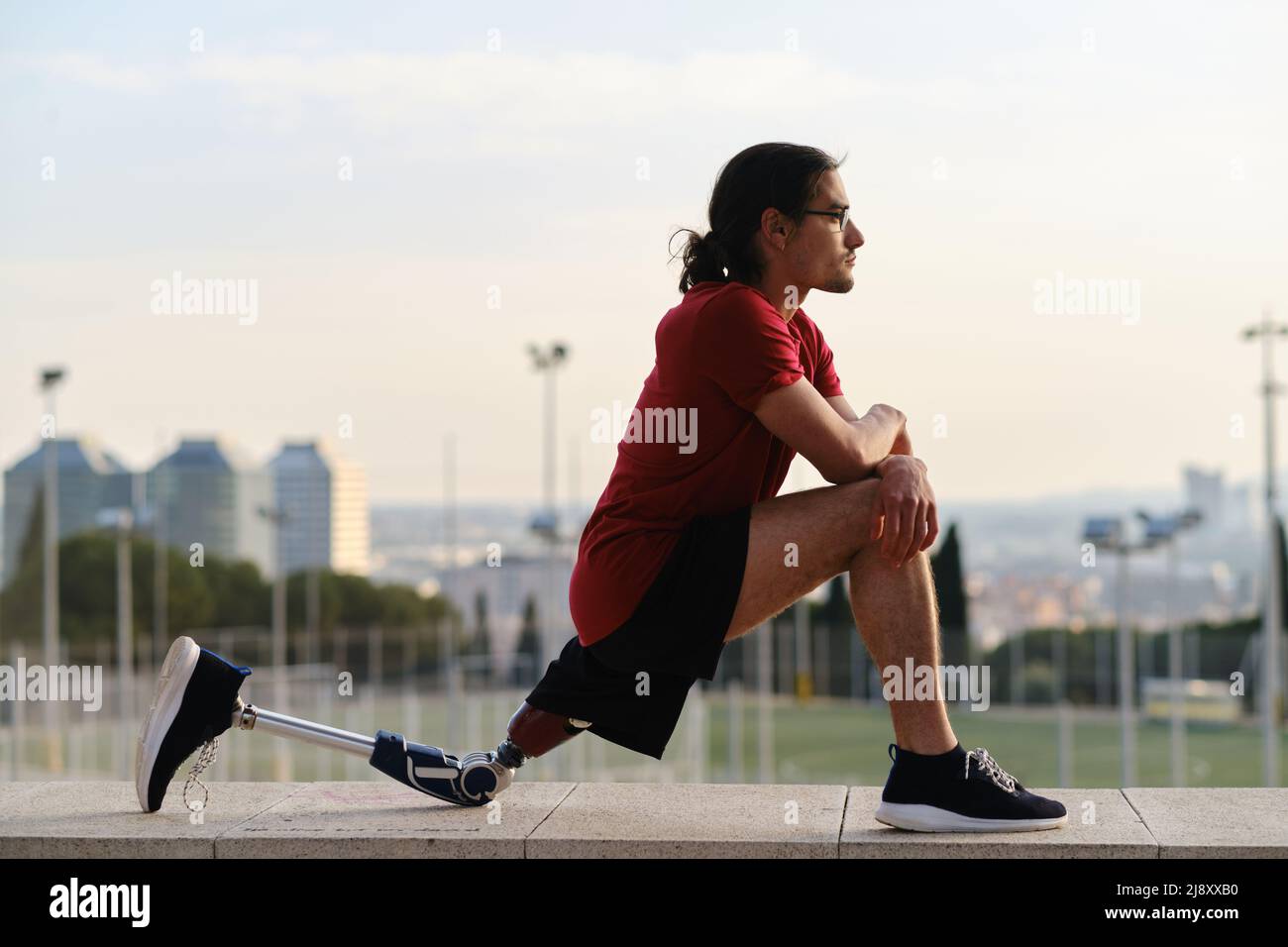Athletic man with a disability exercising outdoors Stock Photo - Alamy