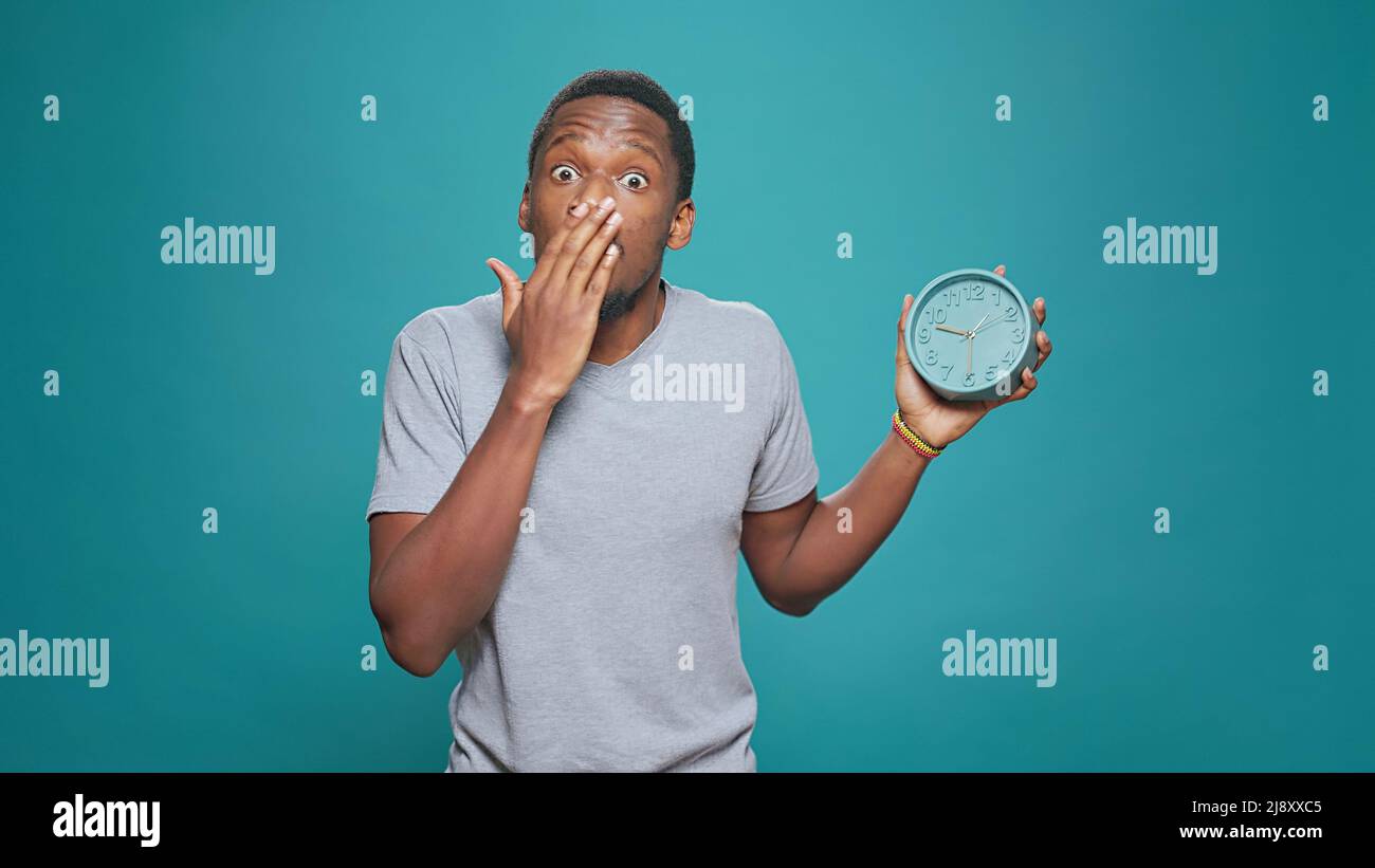 Man looking watch rushing work hi-res stock photography and images - Alamy