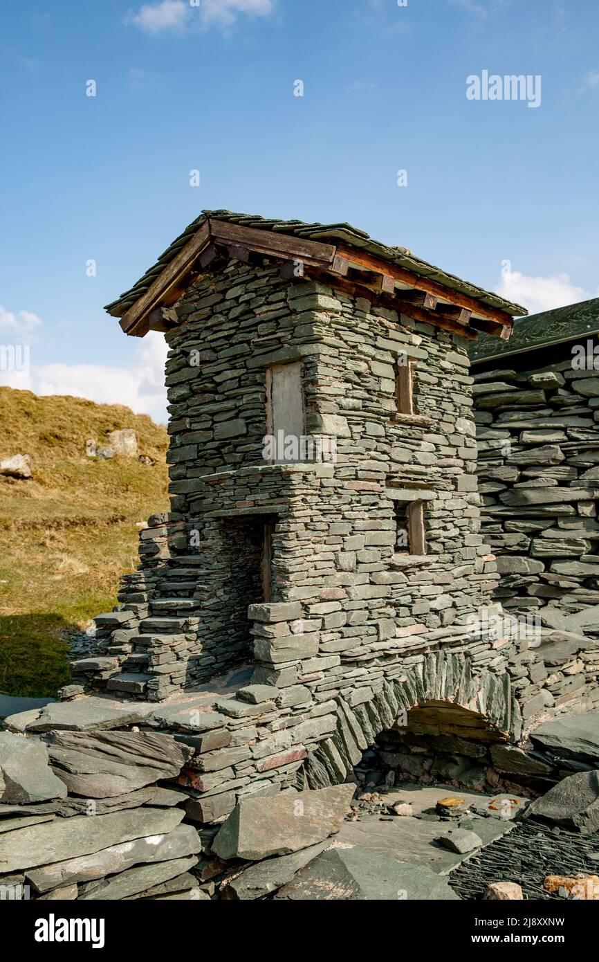 The exterior of a bridge and house made from slate at The Honister ...