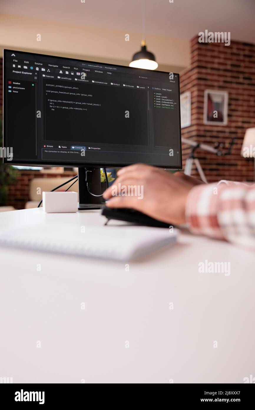 Selective Focus On Computer Screen Of African American Programmer Working Remote From Home