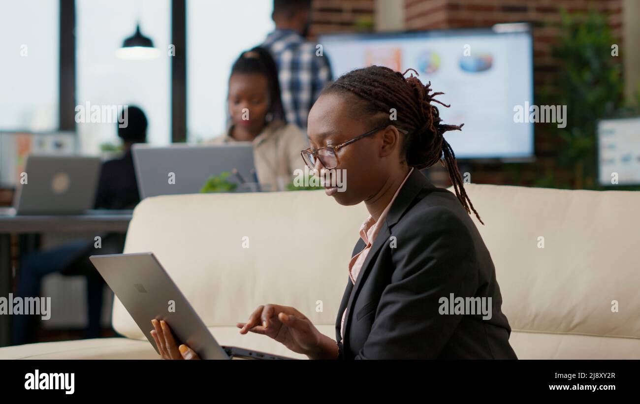 Business woman brainstorming ideas to work on strategy, using laptop ...