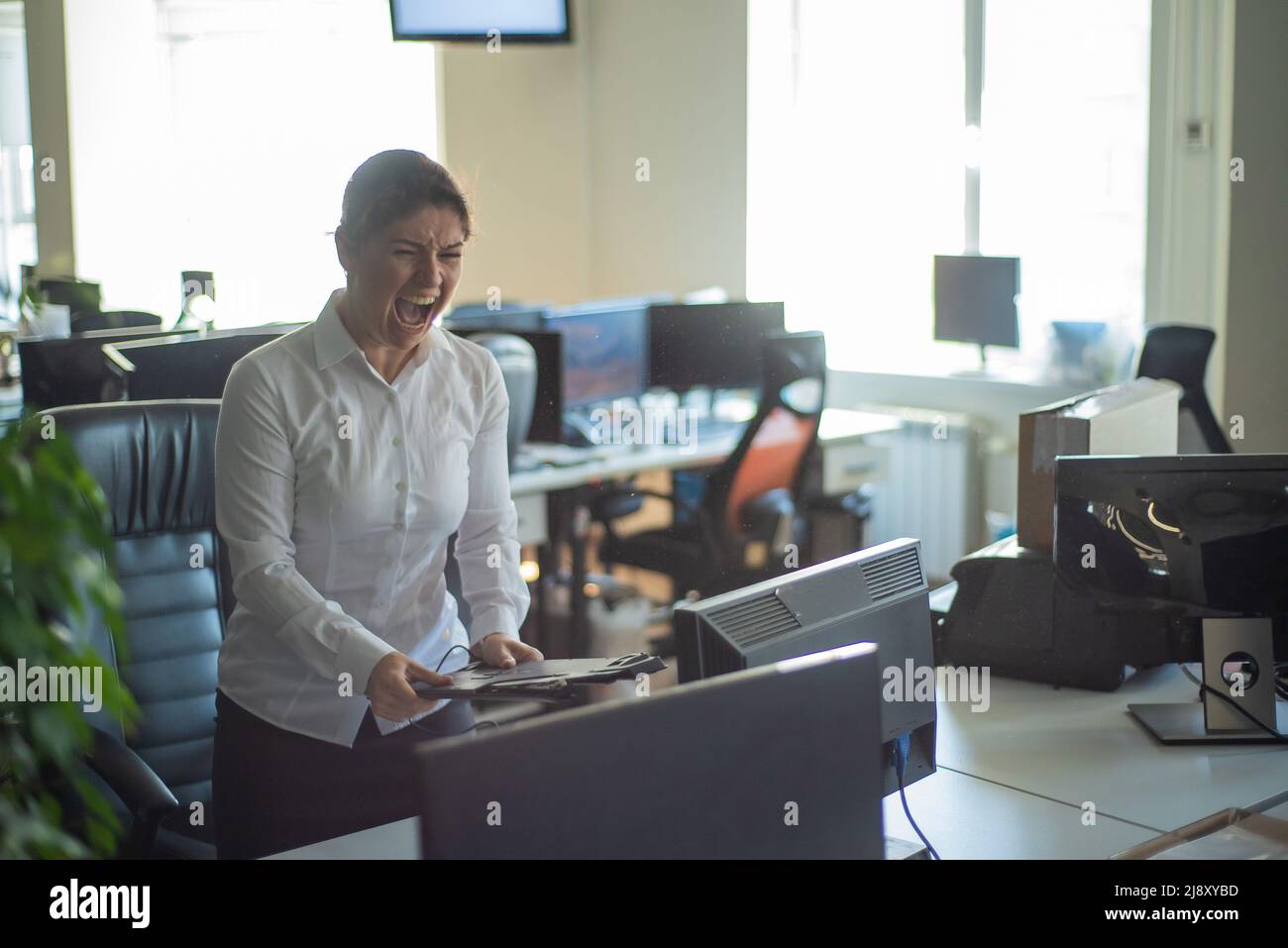 Woman angry computer typing hi-res stock photography and images - Alamy