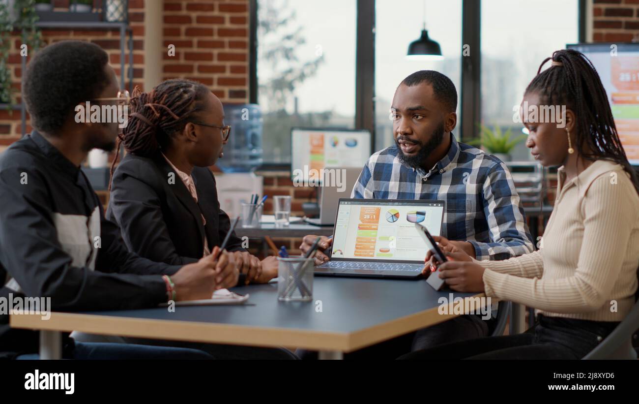 African american team of people collaborating on business strategy ...