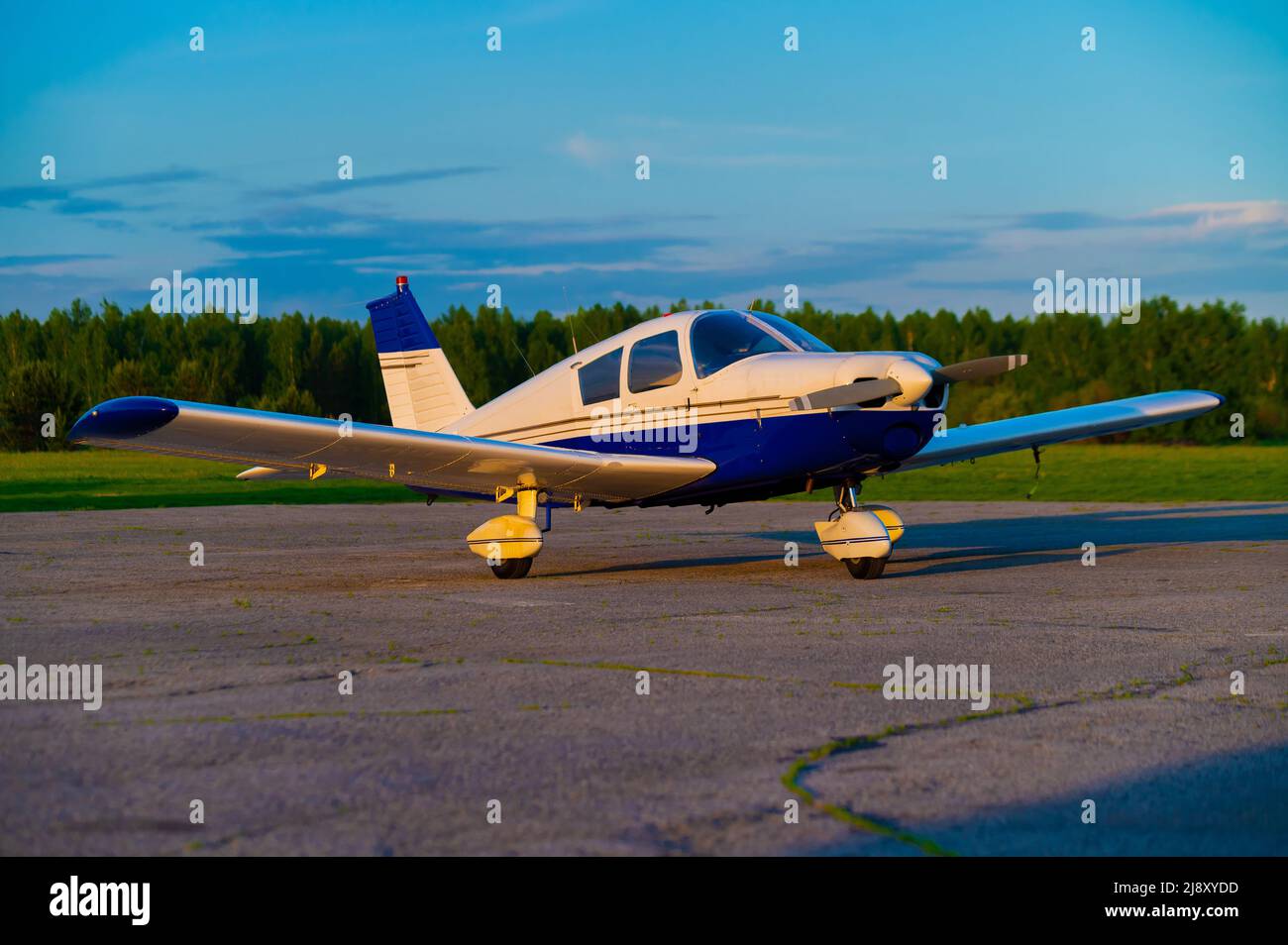 Quadruple aircraft parked at a private airfield. Rear view of a plane ...