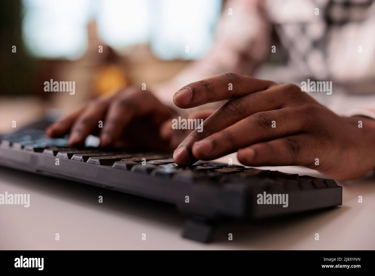 Closeup of african american male content creator writing post for ...