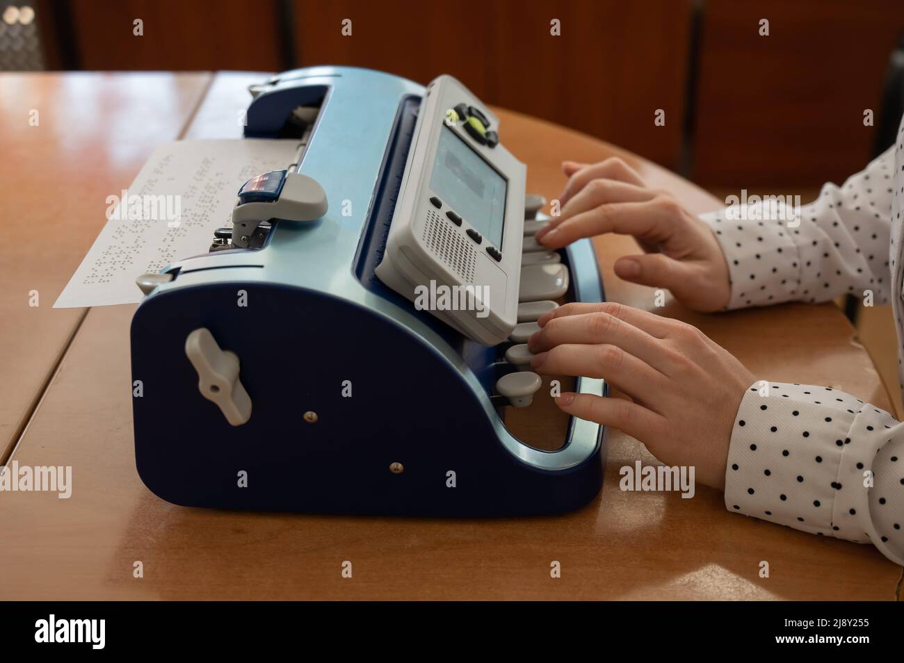 Blind woman using braille typewriter Stock Photo - Alamy