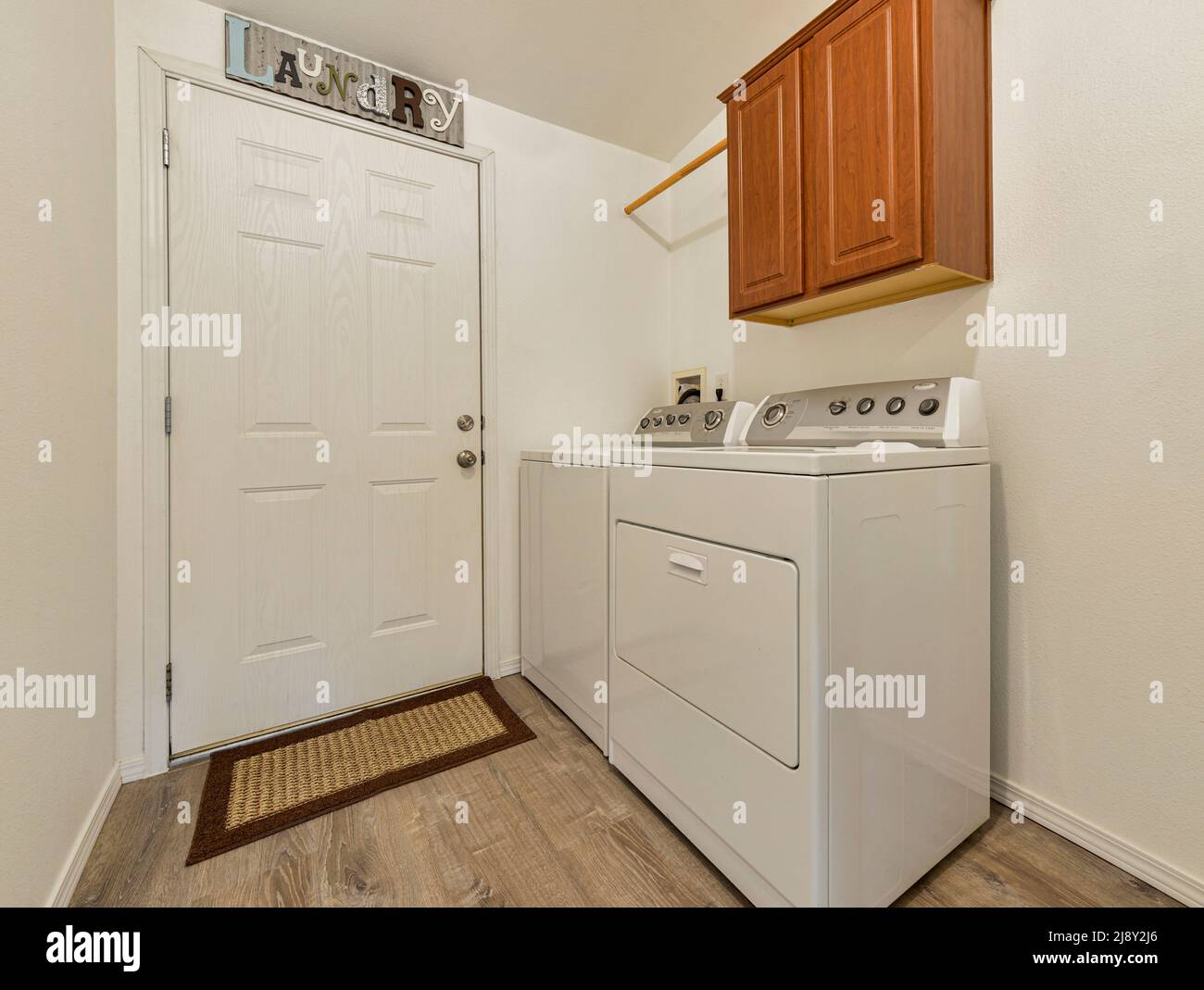 Modern residential laundry room interior Stock Photo - Alamy